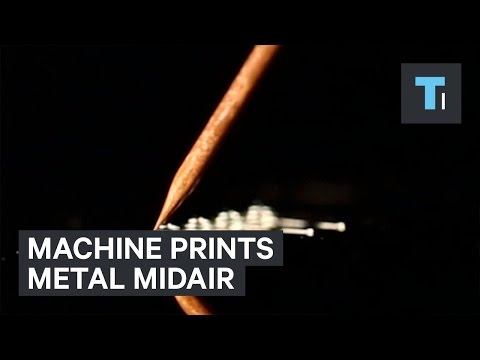 Machine prints metal midair