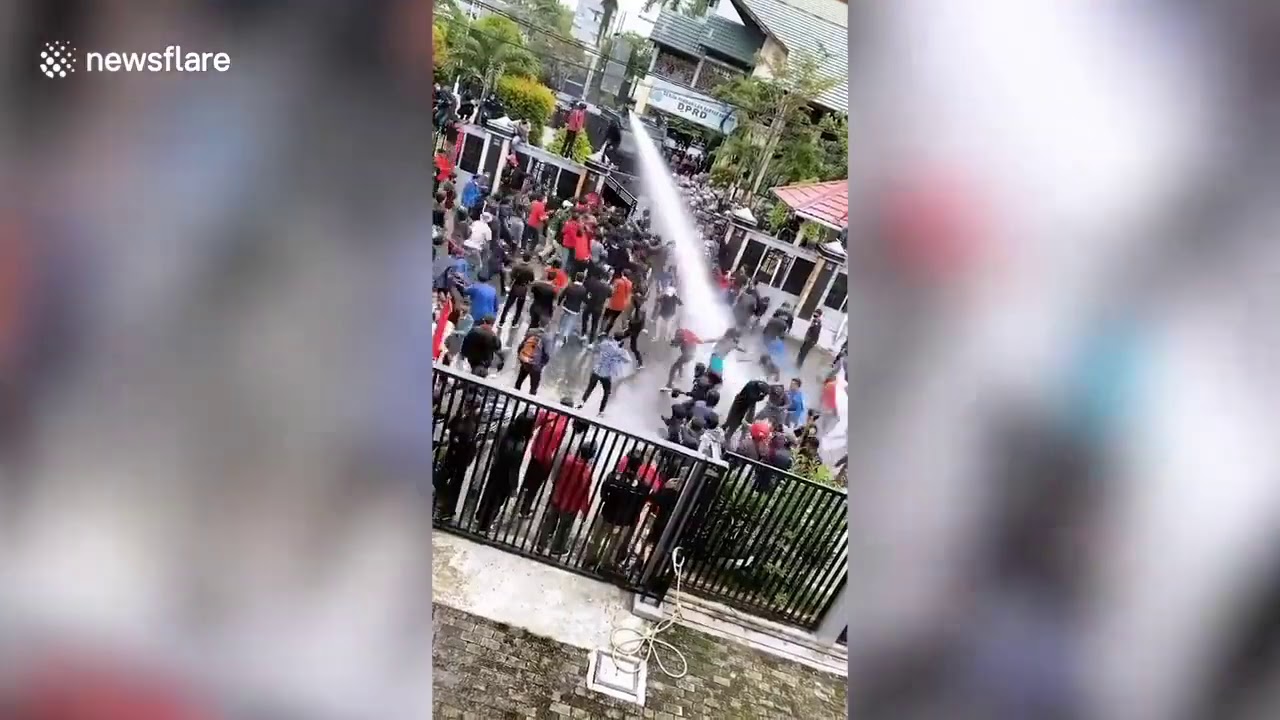 Indonesian police fire water cannons at protesters rallying against jobs law