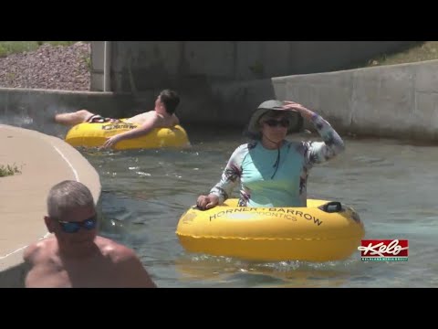 Local pools packed with people to fight the heat