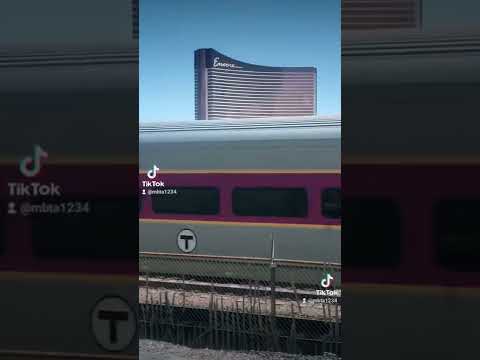 Commuter rail trains passing Assembly