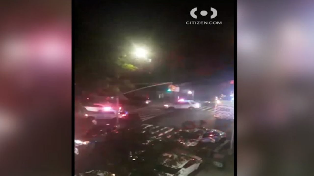 NYPD officer hospitalized after being struck in head with bottle