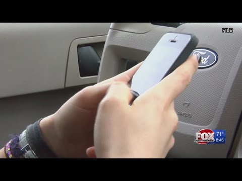 Proposed ban of handheld phone use while driving