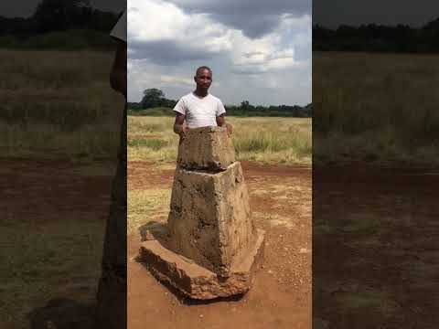 Masai Mara, Kenya: Jumping between the marker dividing Kenya and Tanzania