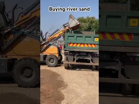 South African builder - loading river sand
