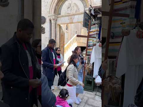 Christian pilgrims walk along the Via Dolorosa during Holy Week in Jerusalem, Israel, 2025.