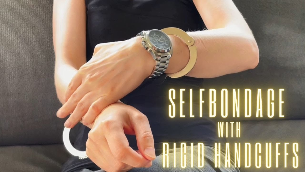 Selfbondage with rigid handcuffs