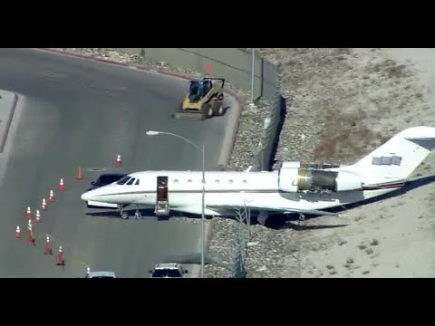 Plane rolls through fence after maintenance worker forgets to set the brakes