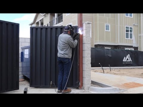 Installing Dumpster Gates at New Apartment Complex