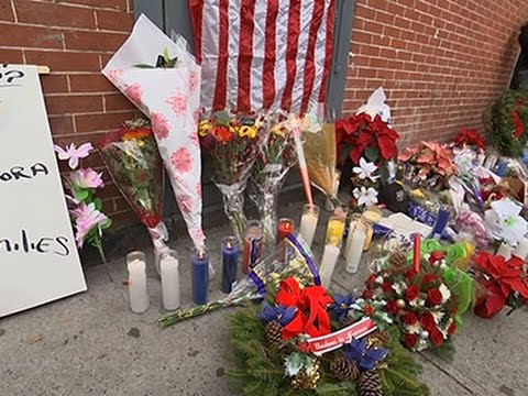 Candles, Flowers Mark Spot of Officers' Deaths