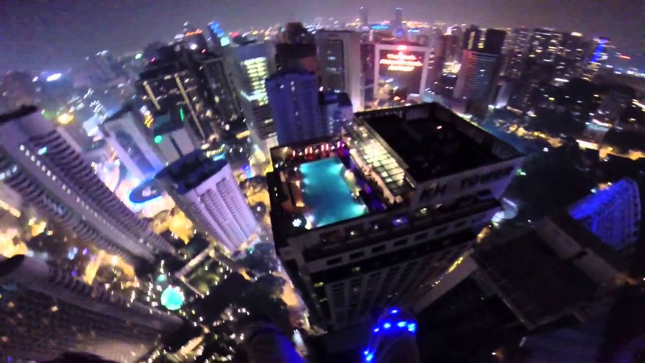 That's one way to crash a pool party - BASE jumpers in Kuala Lumpur