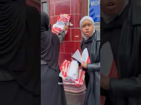 Women seen tearing down posters showing Israeli kidnapping victims in north London