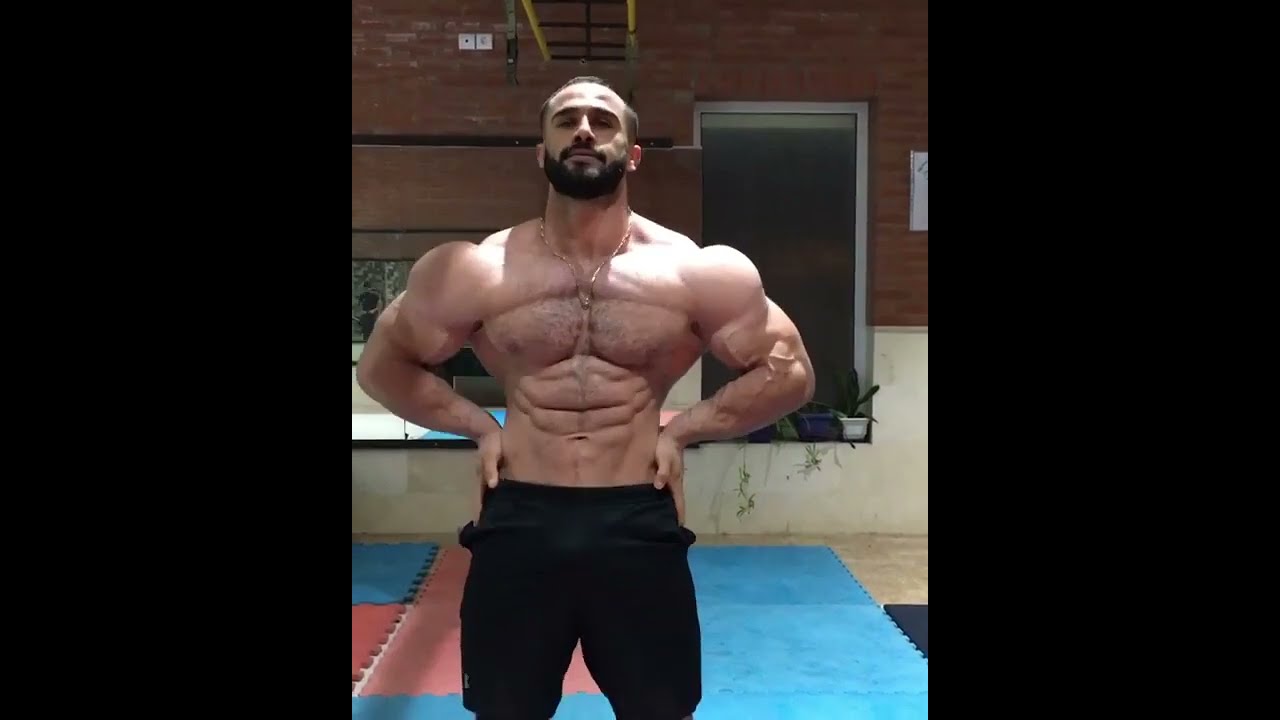 Pumped-up Muscle-God Omid Eskandari flexing his mighty muscles.