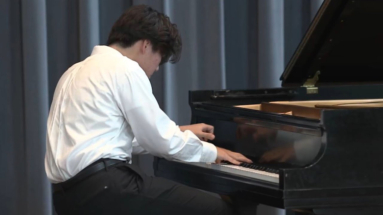 Teen piano virtuoso hitting the right notes