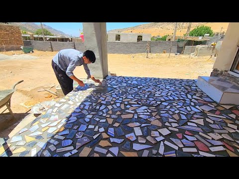 "Decorating and beautifying the front porch with broken tiles by Abu and Ali"