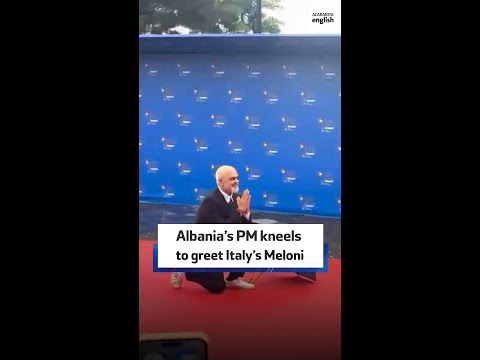 Albania’s PM kneels to greet Italy’s Meloni