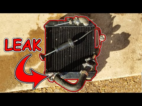 Tractor Mechanic Solders Radiator