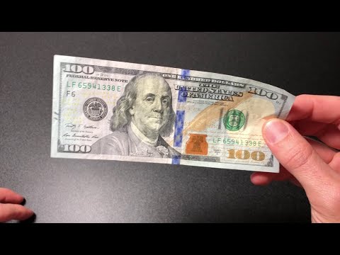 How to spot a fake $100 dollar bill