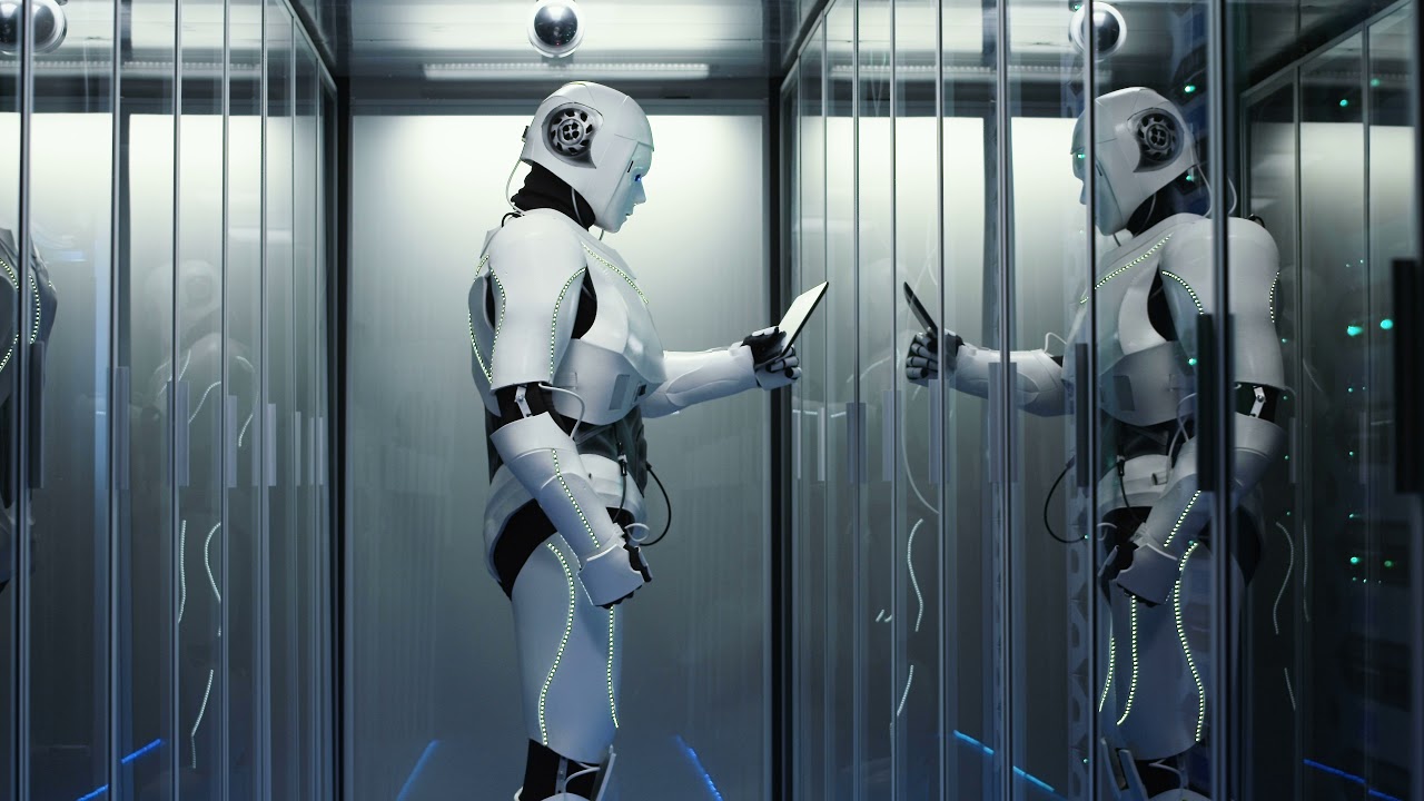 Free 4K Ultra HD Video Templates: Humanoid Robot Checking Servers In A Data Center