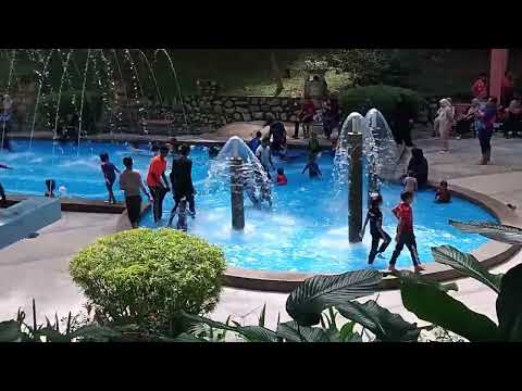 Happy people in public swimming pool Georgetown, Penang, Malaysia 30.11.2024