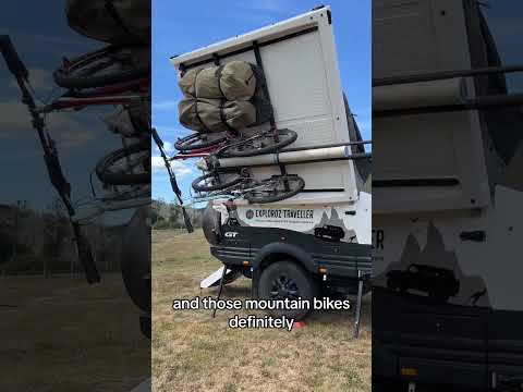 How the 2023 ultimate camper trailer opens up and we how we store our bikes and gear