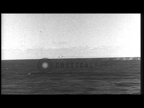 A British Pom Pom gun shoots down an enemy aircraft in the Atlantic Ocean during ...HD Stock Footage