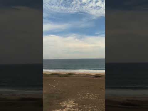 airplane flying next to the ocean Manzanillo Colima, Mexico Pacific Coast