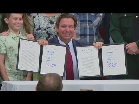Jim speaks with family members after Gov. Ron DeSantis signs the Tristin Murphy Act into law