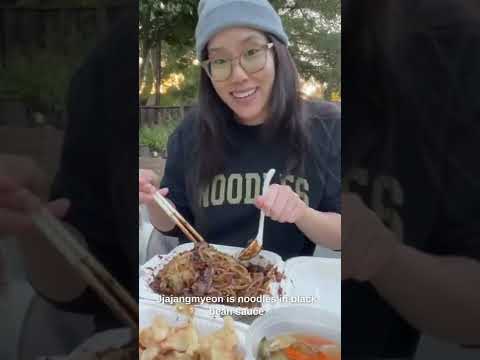 Eating jjajangmyeon (Korean black bean noodle)