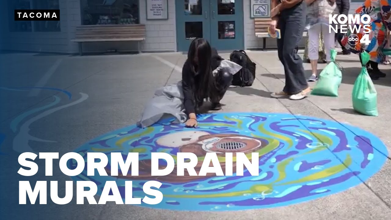 Students paint storm drain murals