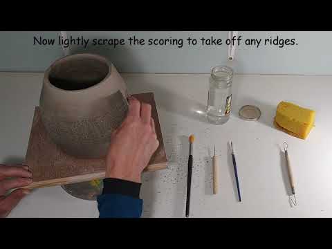 Pottery - scoring detail into a clay form