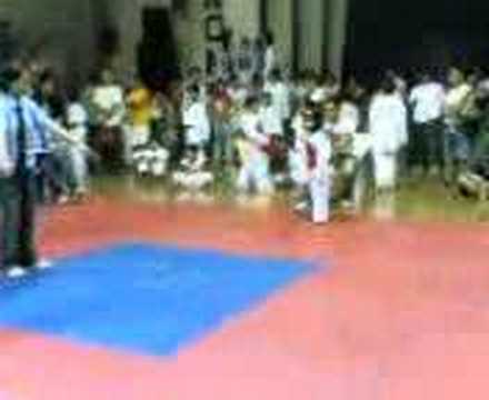 his 2nd taekwondo sparring, won the gold! wearing red