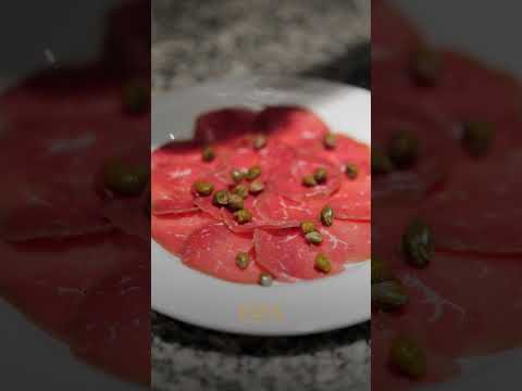 ENZO'S TANGIER | Fresh Carpaccio with a Drizzle of Balsamic Elegance.