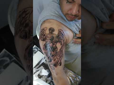 Angel with praying hands tattoo