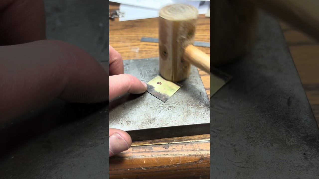 A .223 casing cross made of nails