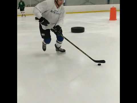 Power Skating: Agility, jump over tire, land in stop, transition backward with puck.