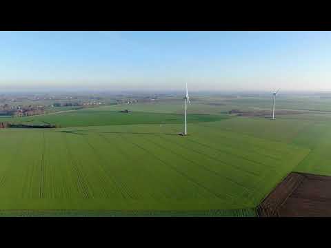 Aerial view of windmills and agricultural fields in South of Belgium in 4K | Free Stock Video