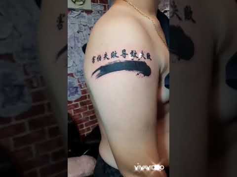 Chinese Lettering Tattoo On Man Shoulder | Writing tattoos, Chinese symbol tattoos, Tattoos for guys