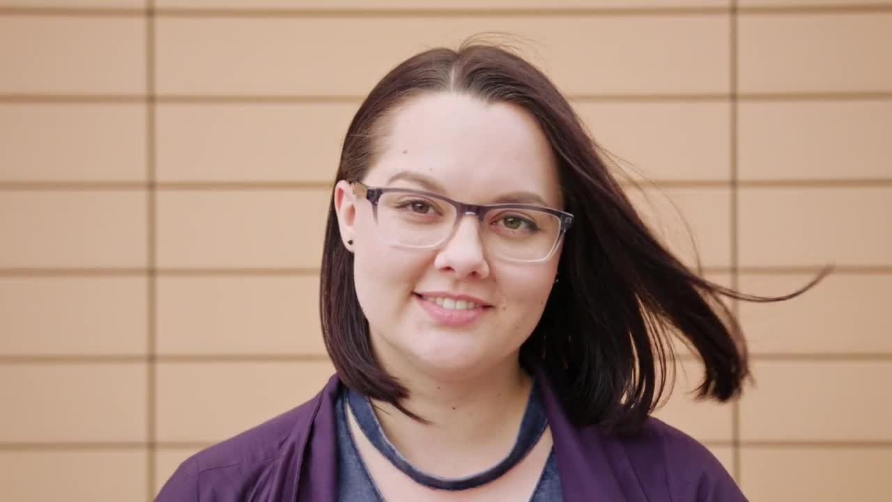 Beautiful Brunette With Glasses Smiles Stock Video
