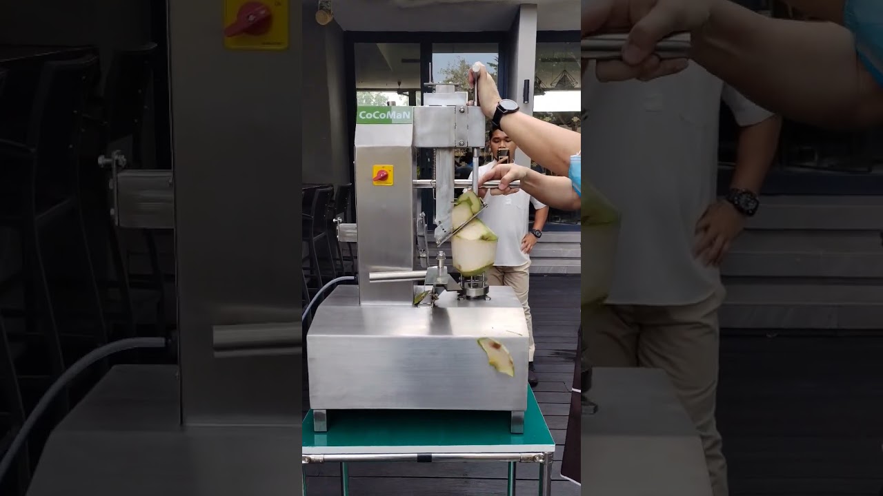 Demonstrating the operations of young coconut trimming machine COM90YD2 at customer's location.