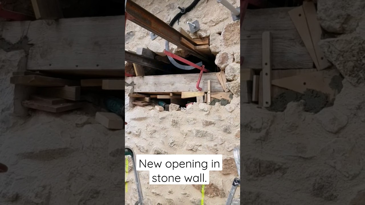 New opening through solid stone wall stage 1 complete. Just let concrete set solid before next stage