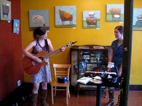 Gina Belliveau performs at Amocat Cafe Grand opening