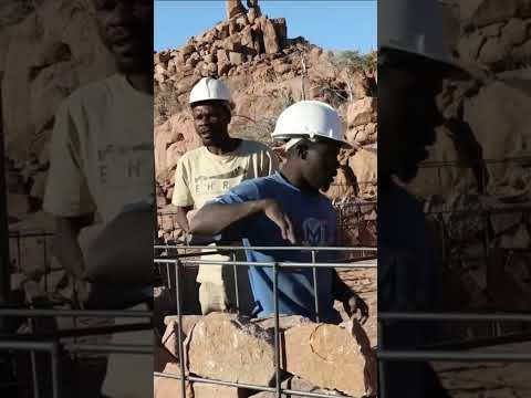 A soulful moment: construction workers break into song while building in the desert heat.