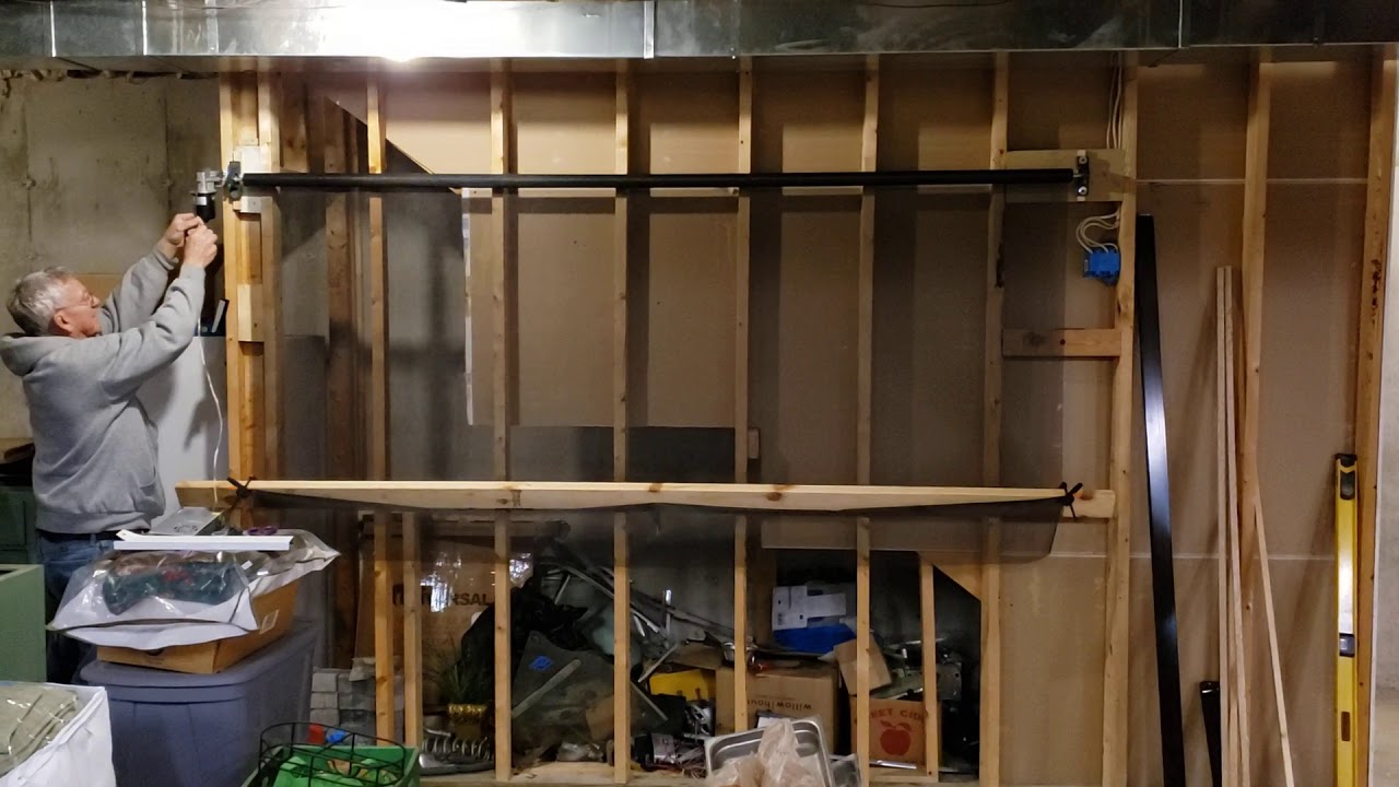 DIY mostly homemade motorized retractable porch screen.