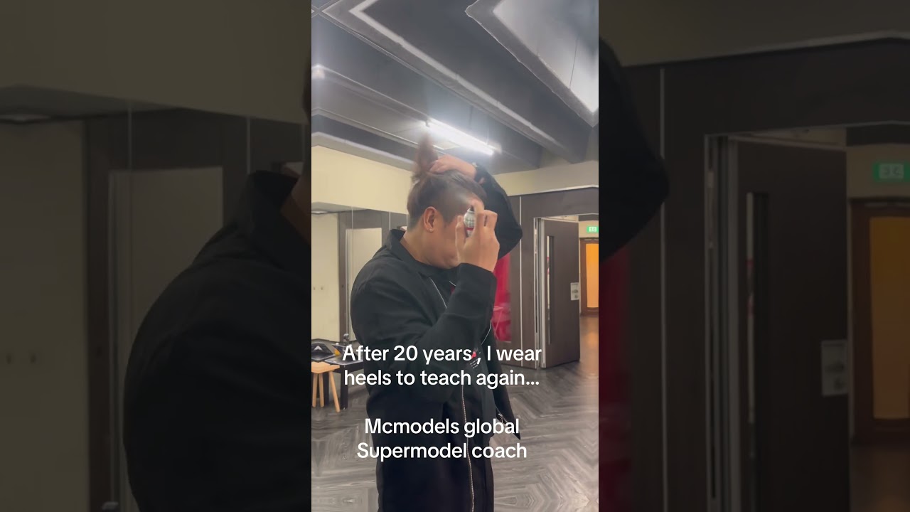 Male model coach wearing heels to coach catwalk lesson by Mcmodels academy