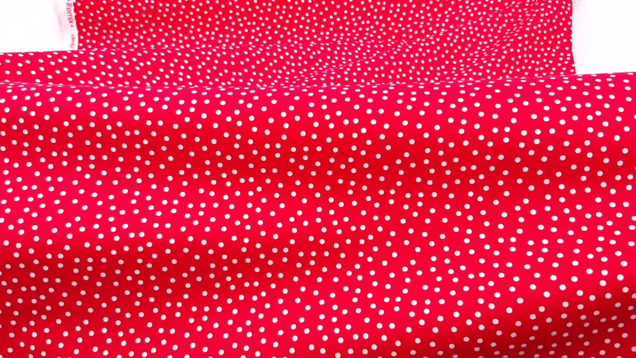 red Robert Kaufman fabric with mini white polka dots