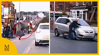Moment suspect is hit by car after fleeing from police - Manchester ...