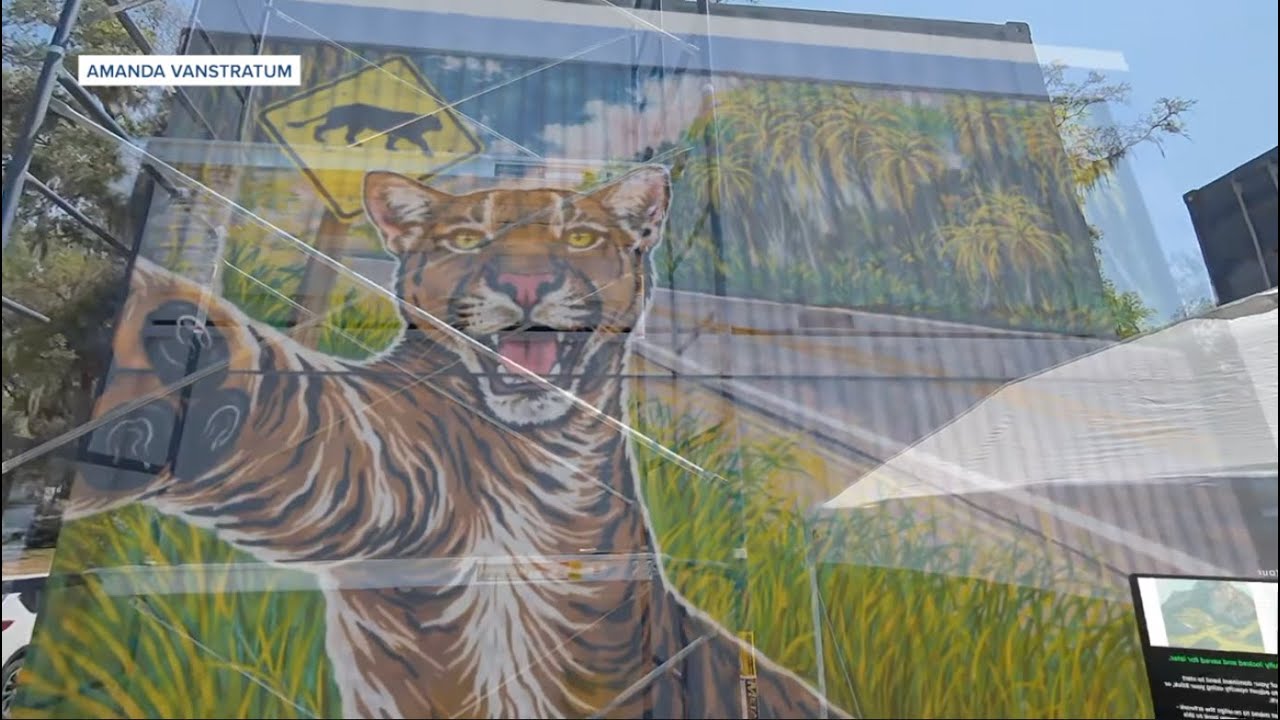 Artists begin painting large-scale shipping container murals at SoMo Walls