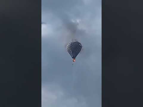 Harrowing video shows man dangling from hot air balloon #shorts