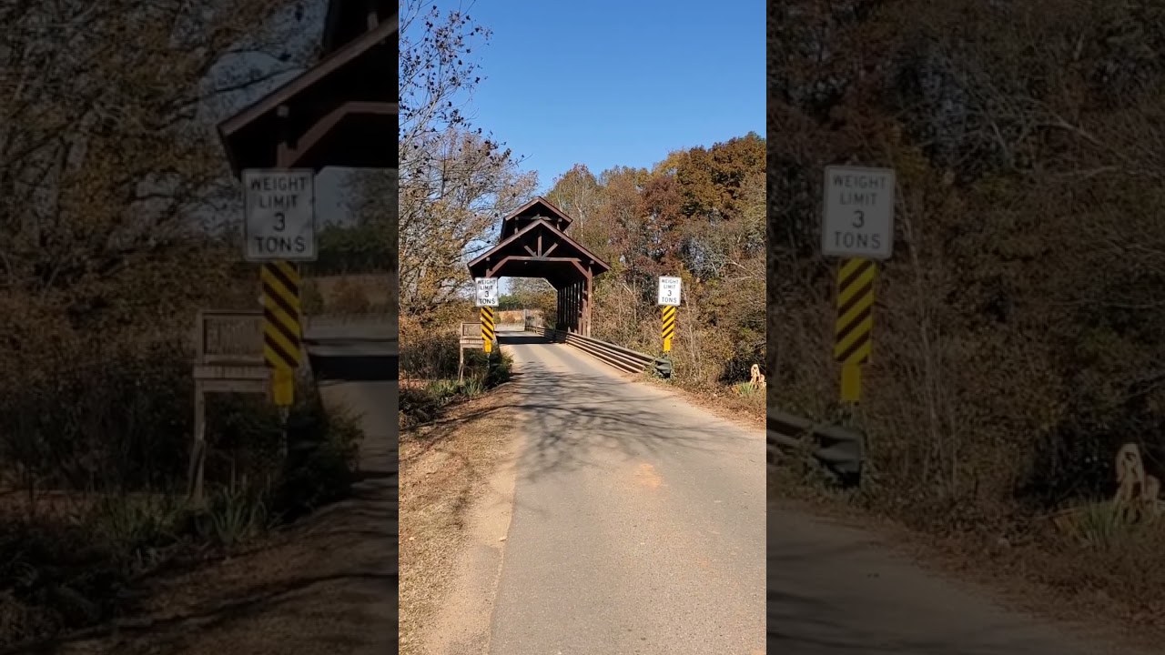 Its a one lane bridge with a barn over it.