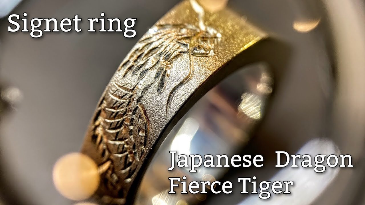 Carving Japanese dragon and tiger on the ring